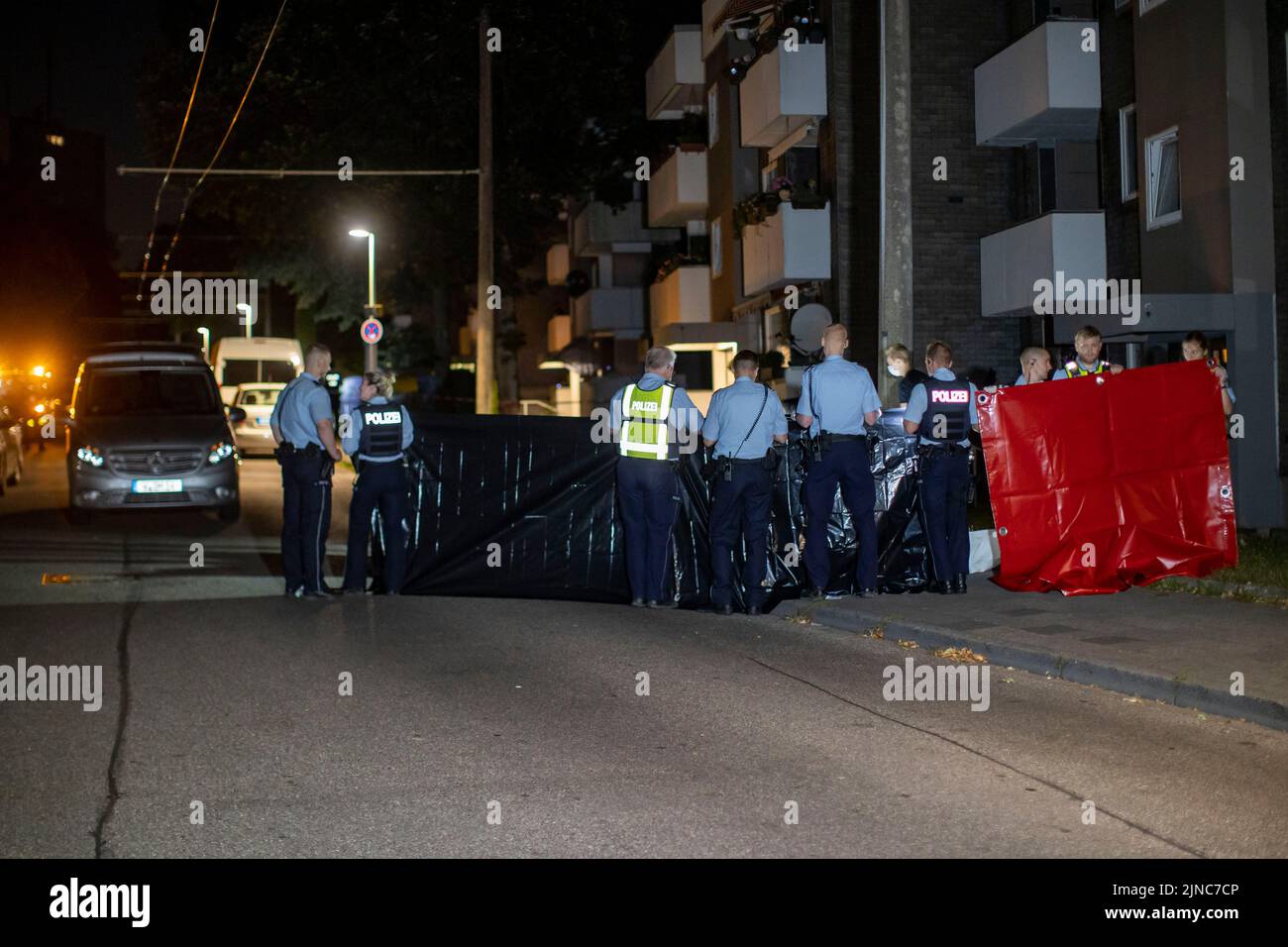 Solingen, Germany. 11th Aug, 2022. Police officers hold a visual screen ...