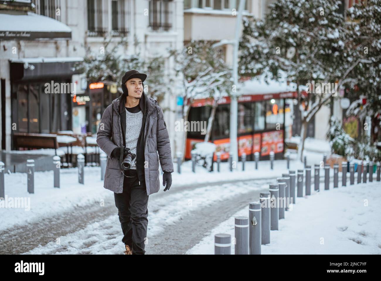 man holding a camera explore the historical city by walking Stock Photo ...