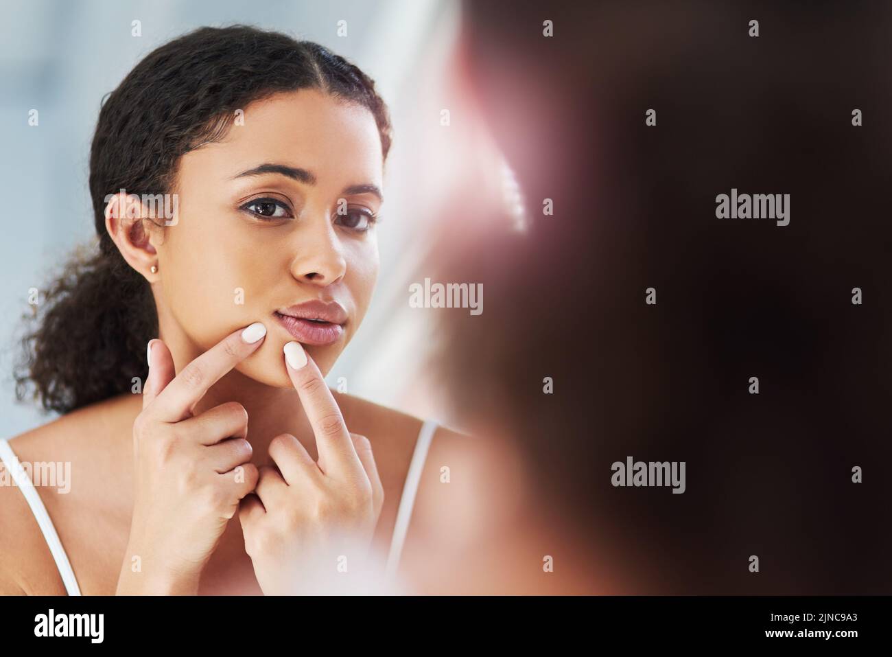 Squeezing might leave you with permanent marks. a beautiful young woman ...