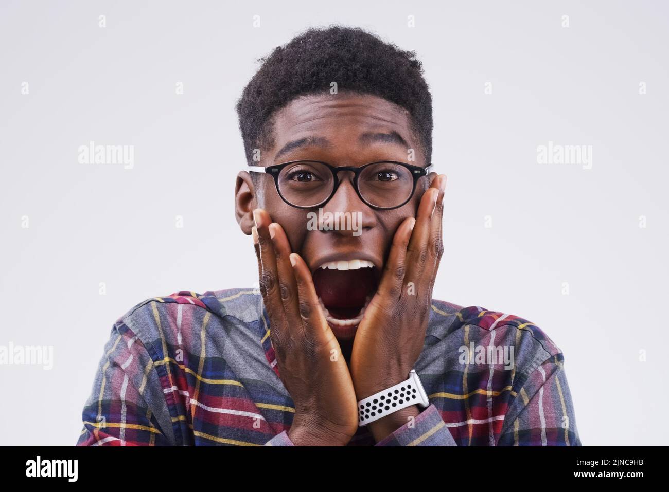 Oh my gosh Are you serious. Studio shot of a young man making a funny ...