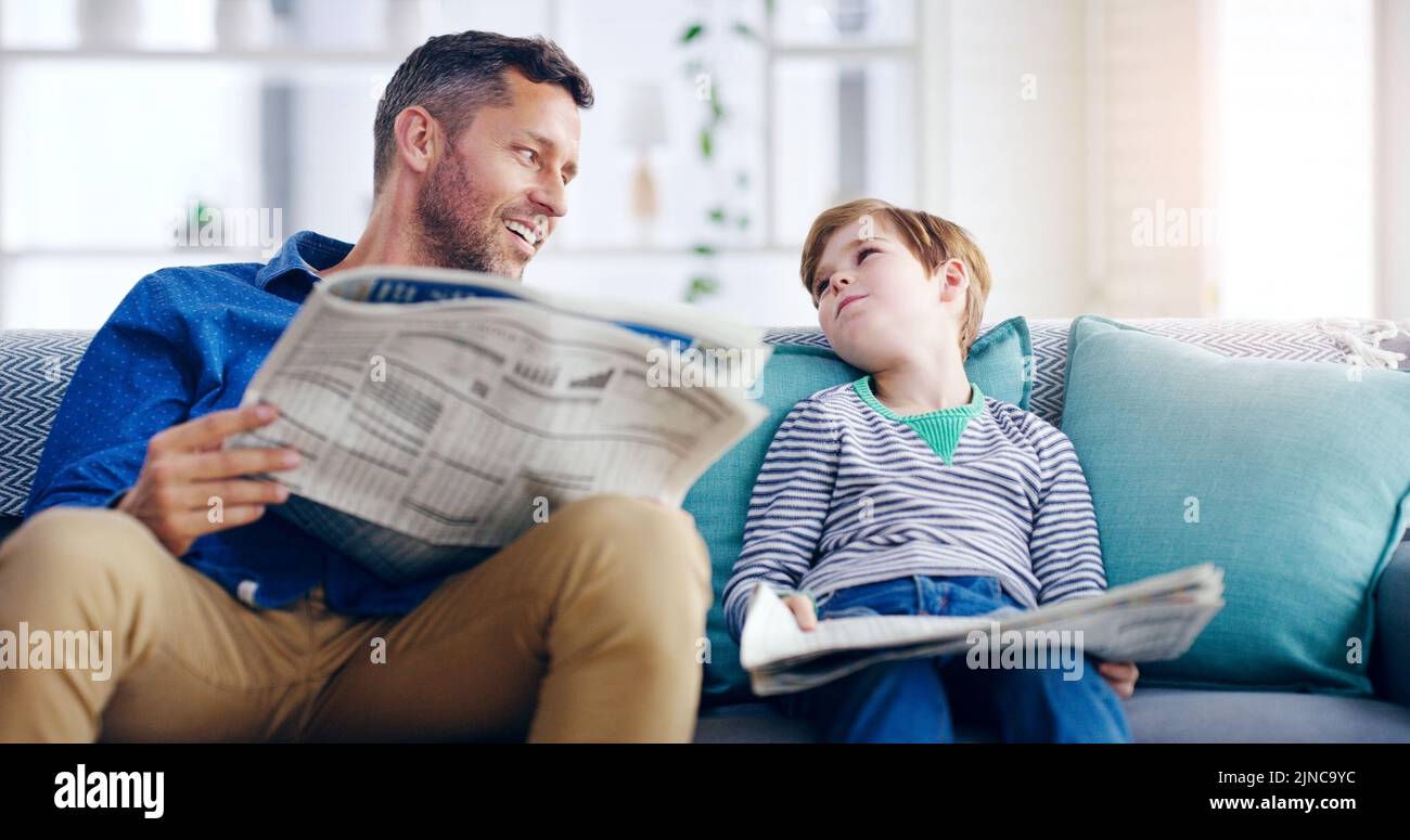 Boy reading newspaper hi-res stock photography and images - Alamy