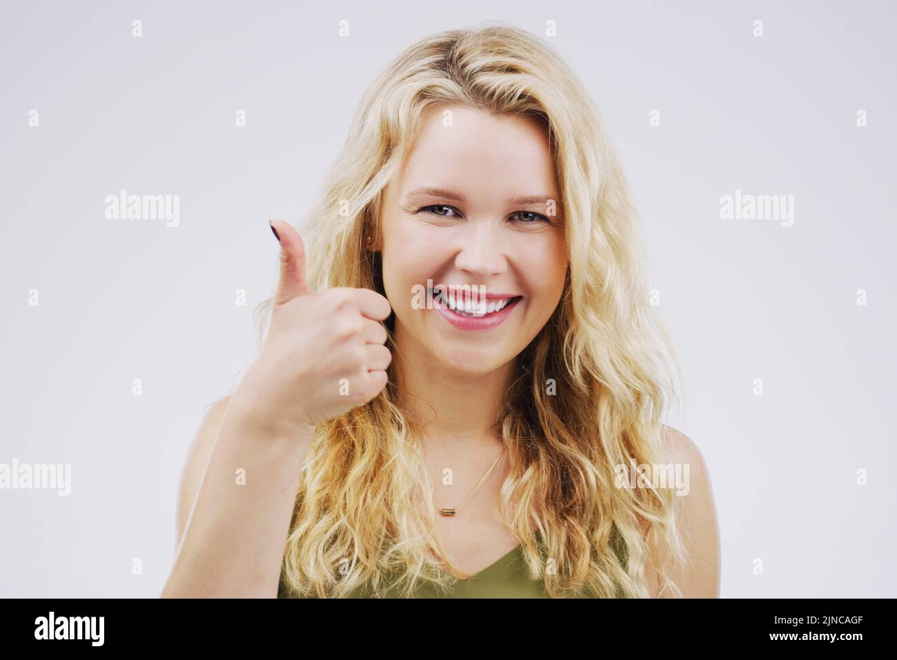 I definitely approve. Studio portrait of an attractive young woman ...