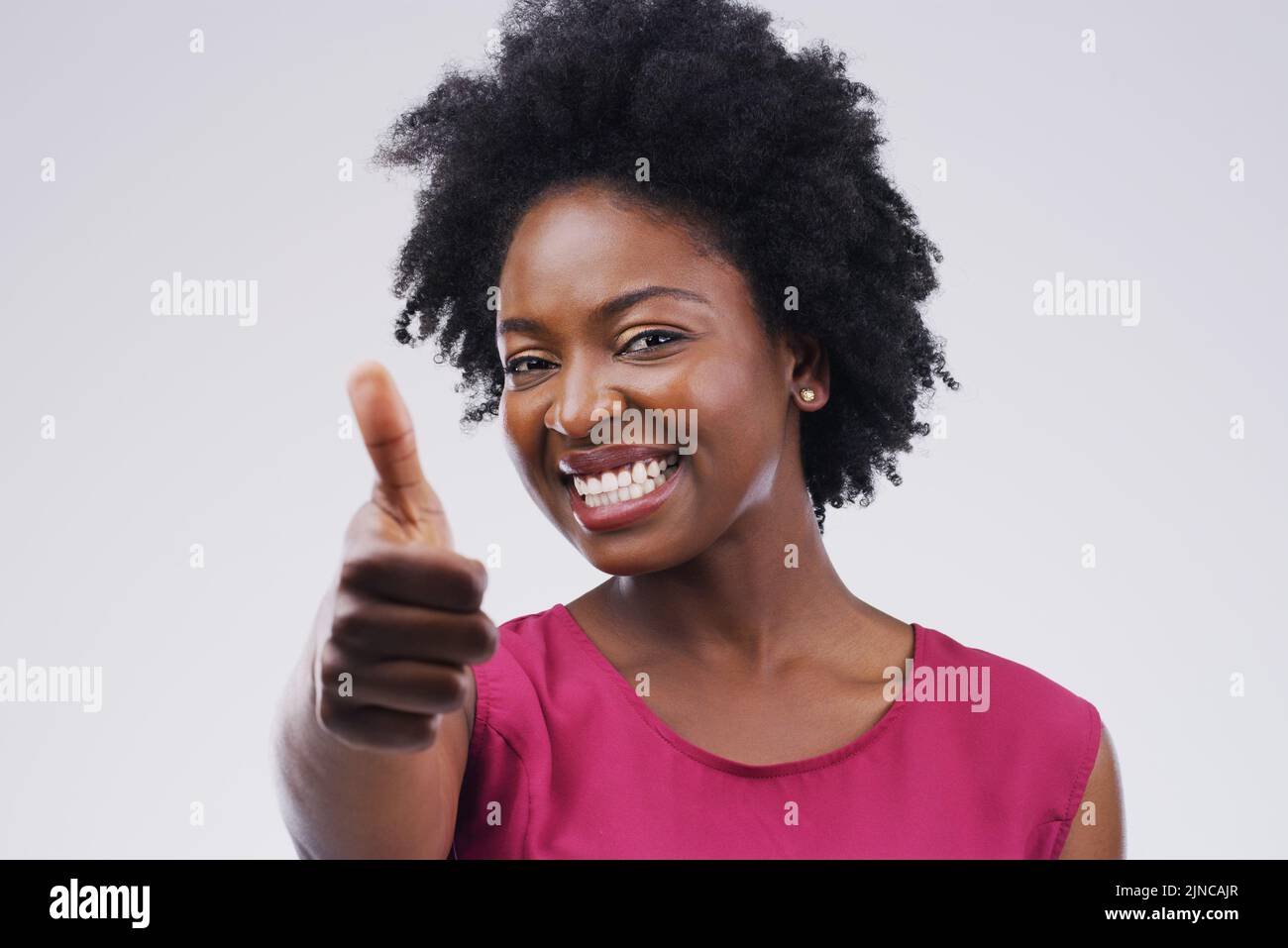 Youve impressed me. Studio portrait of an attractive young woman giving ...