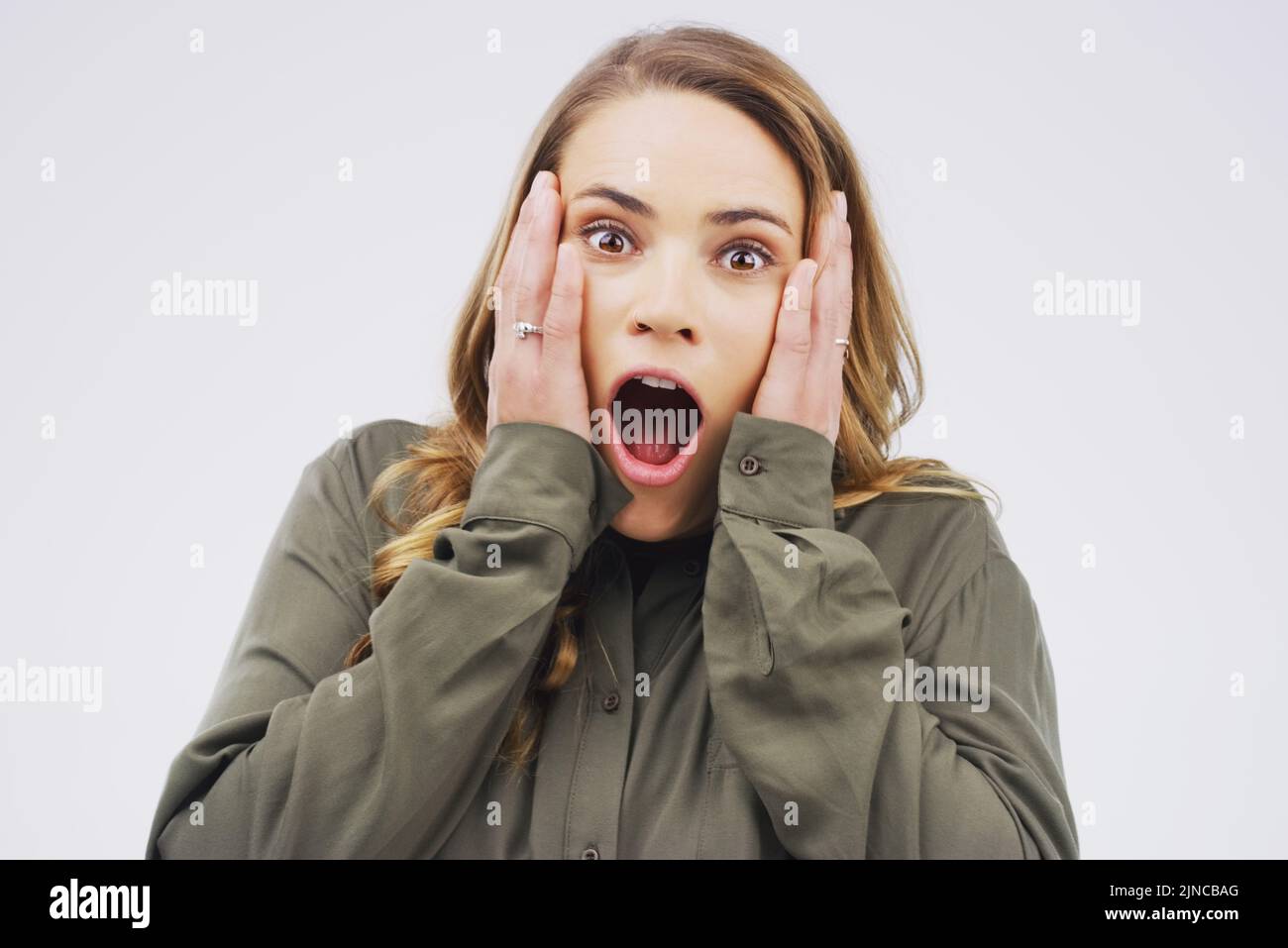I am shocked. Studio portrait of an attractive young woman looking ...