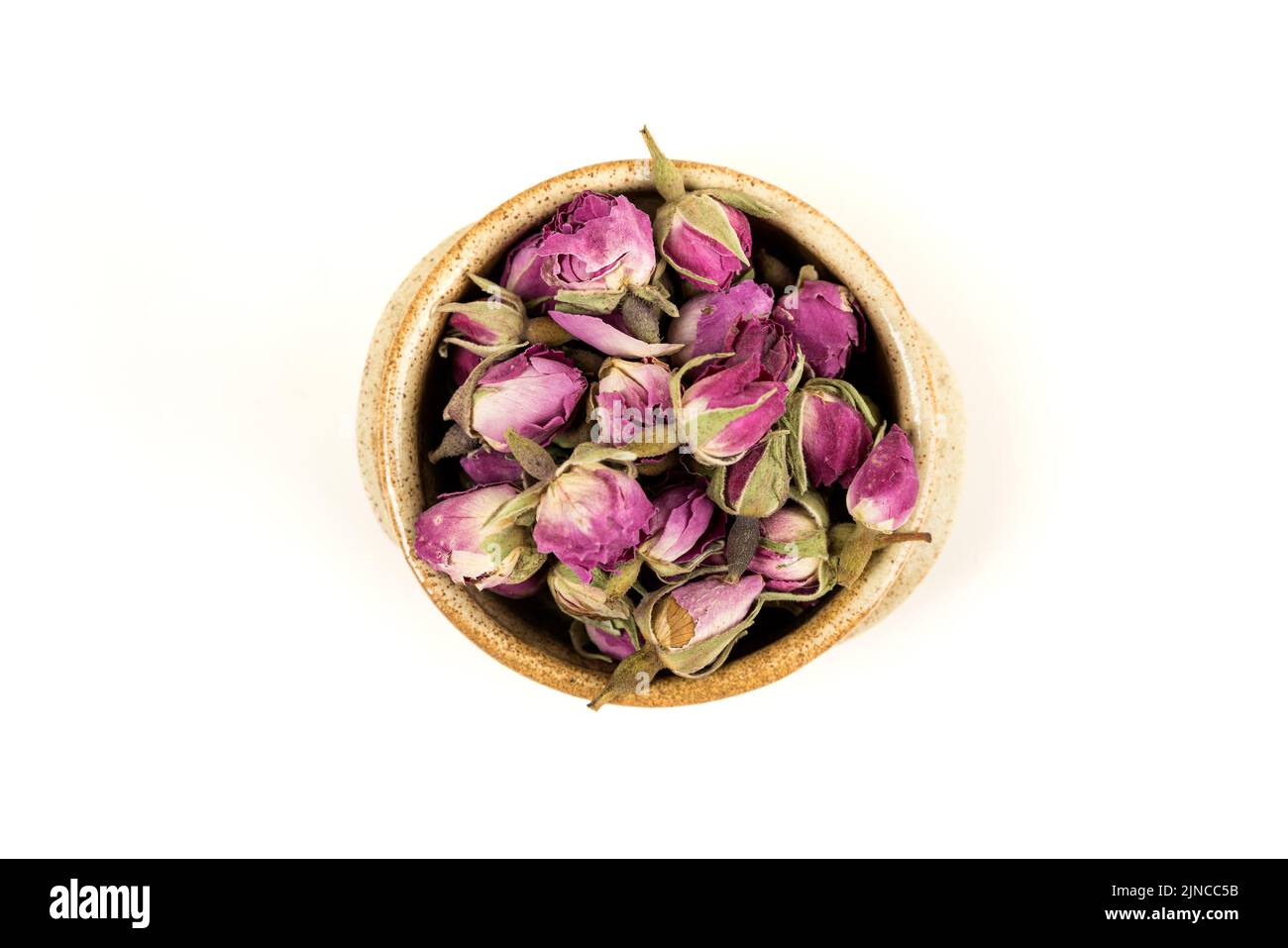 Dehydrated pink rose buds in a ceramic bowl top down view Stock Photo ...