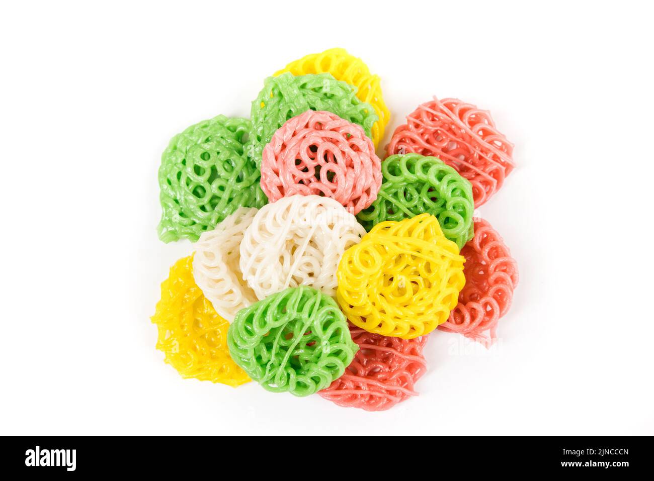 Raw multicolored tapioca crackers in a pile top down isolated over ...