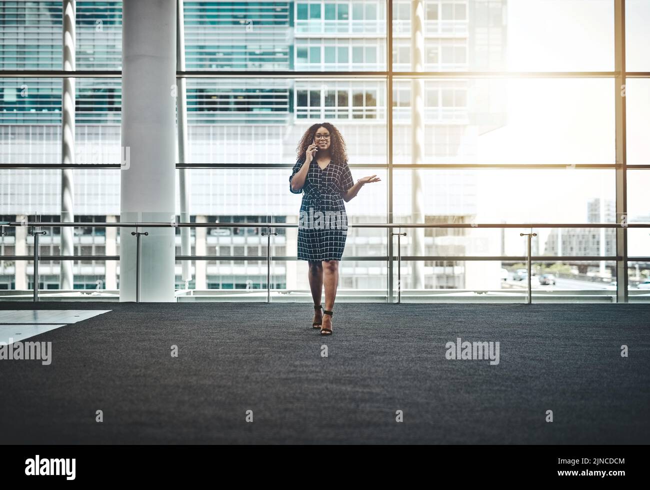 Lady boss talking cellphone walking hi-res stock photography and images ...