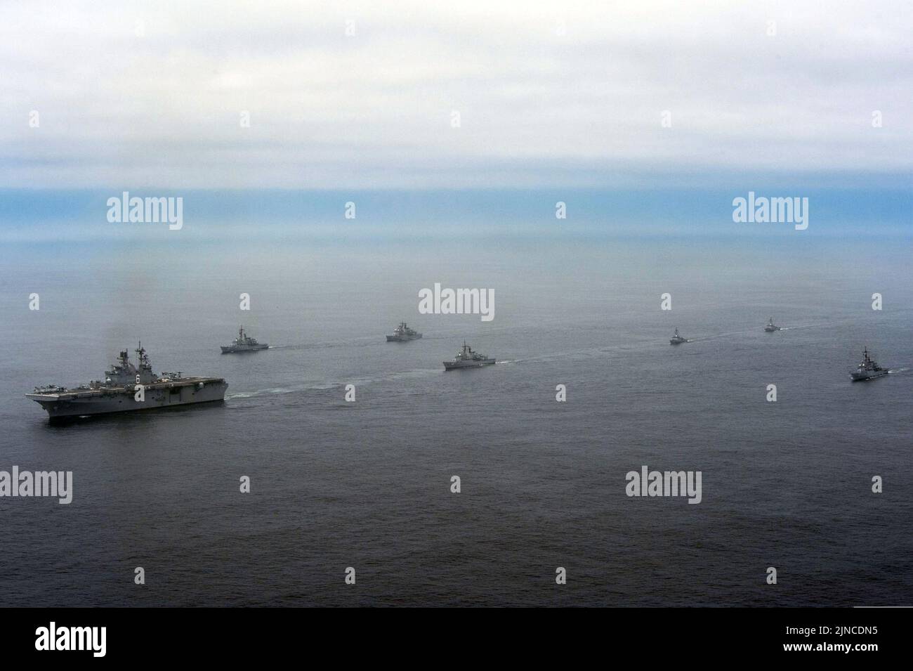 The amphibious assault ship USS America (LHA 6), left, and Peruvian ...