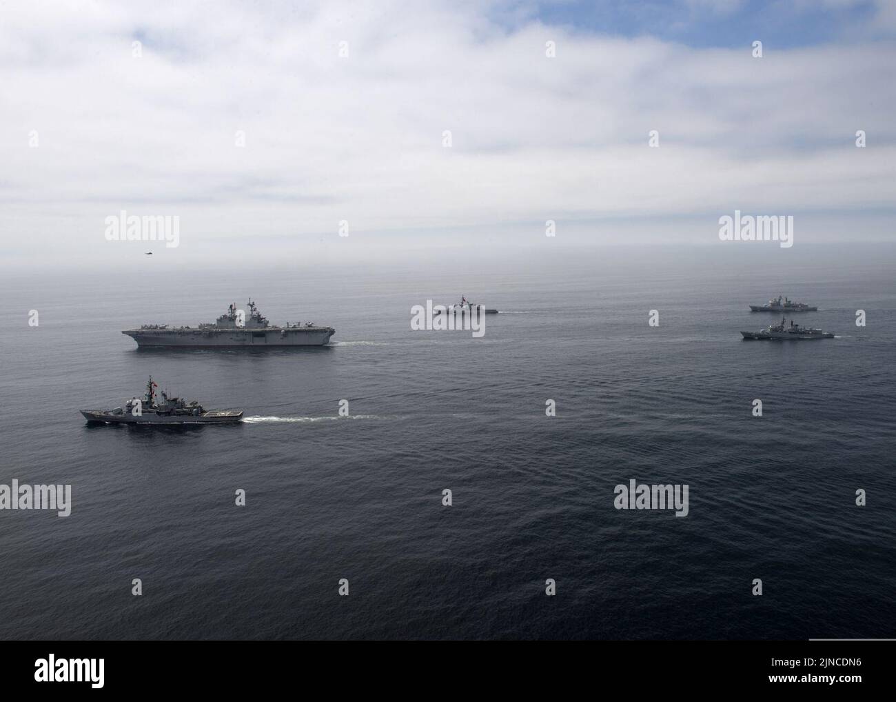 The amphibious assault ship USS America (LHA 6), top left, and Peruvian ...