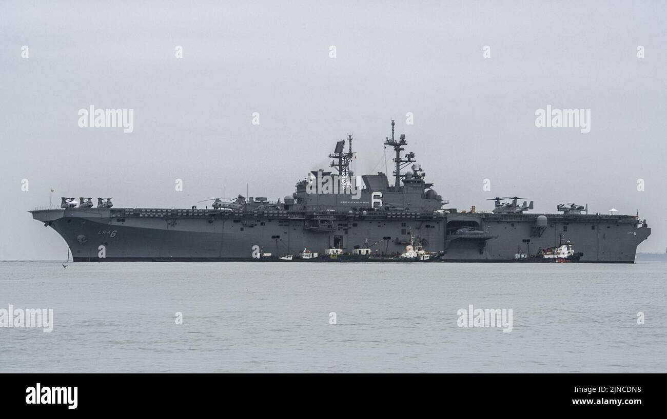 The amphibious assault ship USS America (LHA 6) is anchored in the port ...