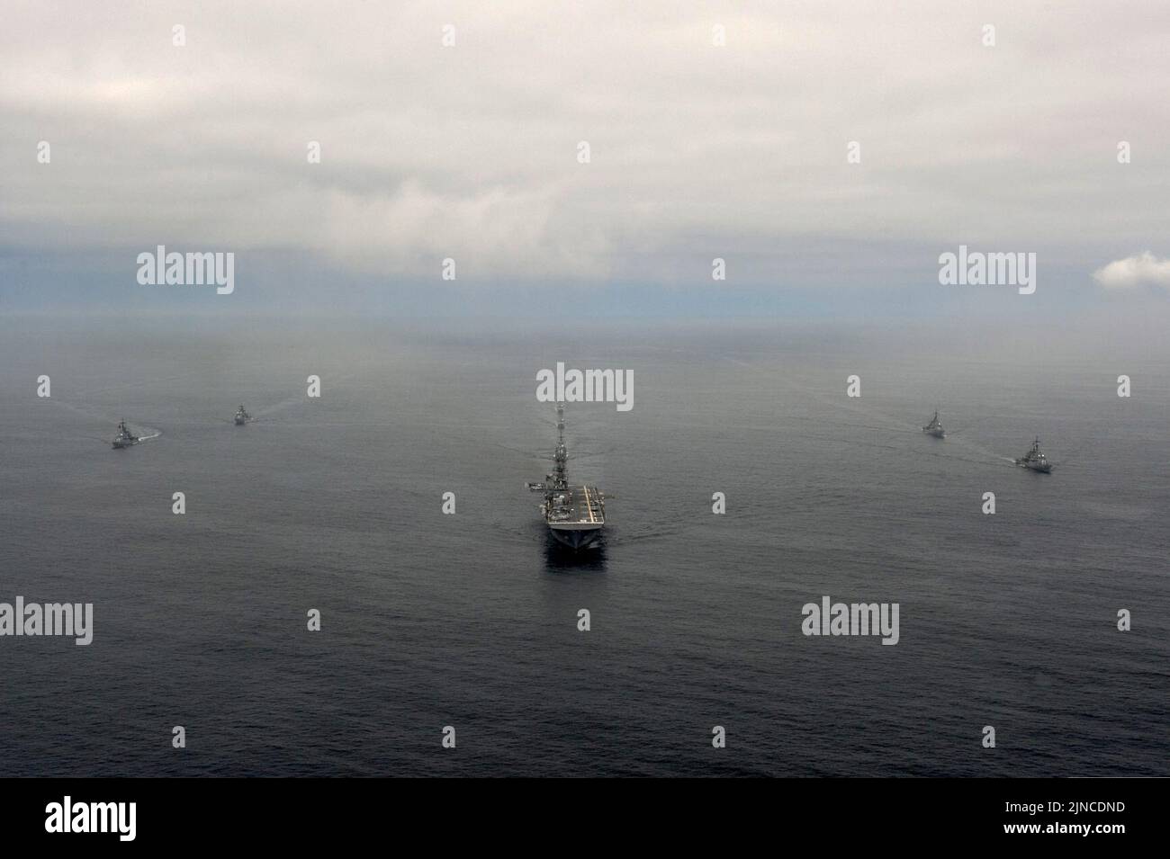 The amphibious assault ship USS America (LHA 6), center, and Peruvian ...