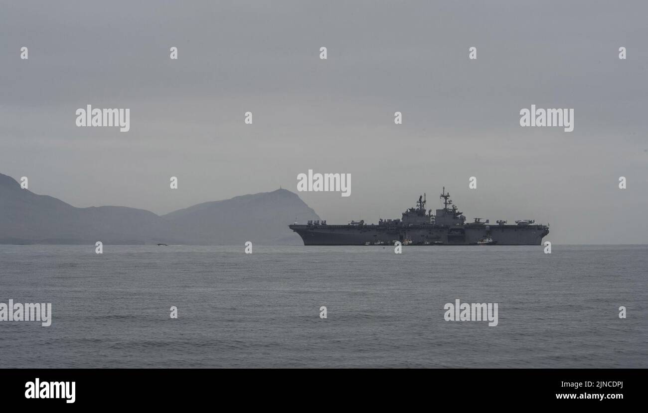 The amphibious assault ship USS America (LHA 6) is anchored in the port ...