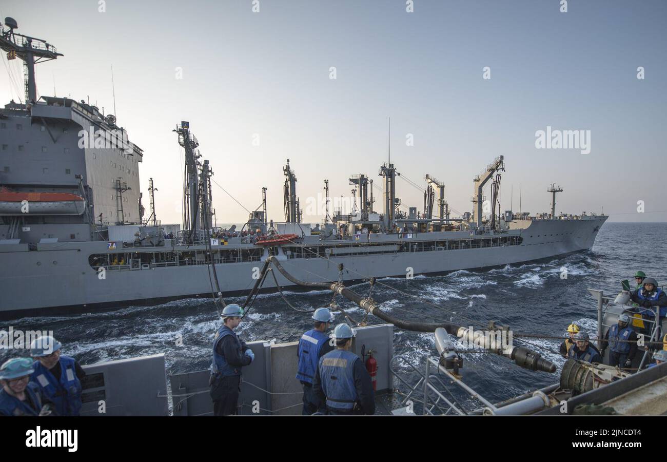 The amphibious transport dock ship USS Denver (LPD 9), front, prepares ...