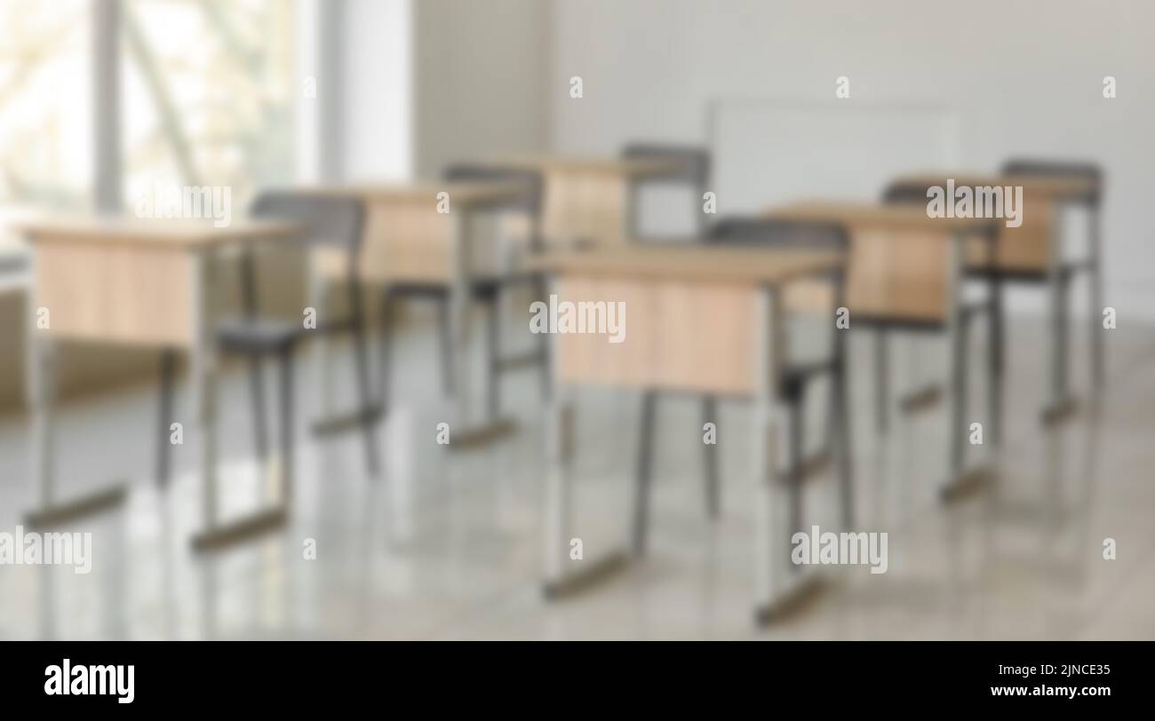Interior of empty light classroom, blurred view Stock Photo - Alamy
