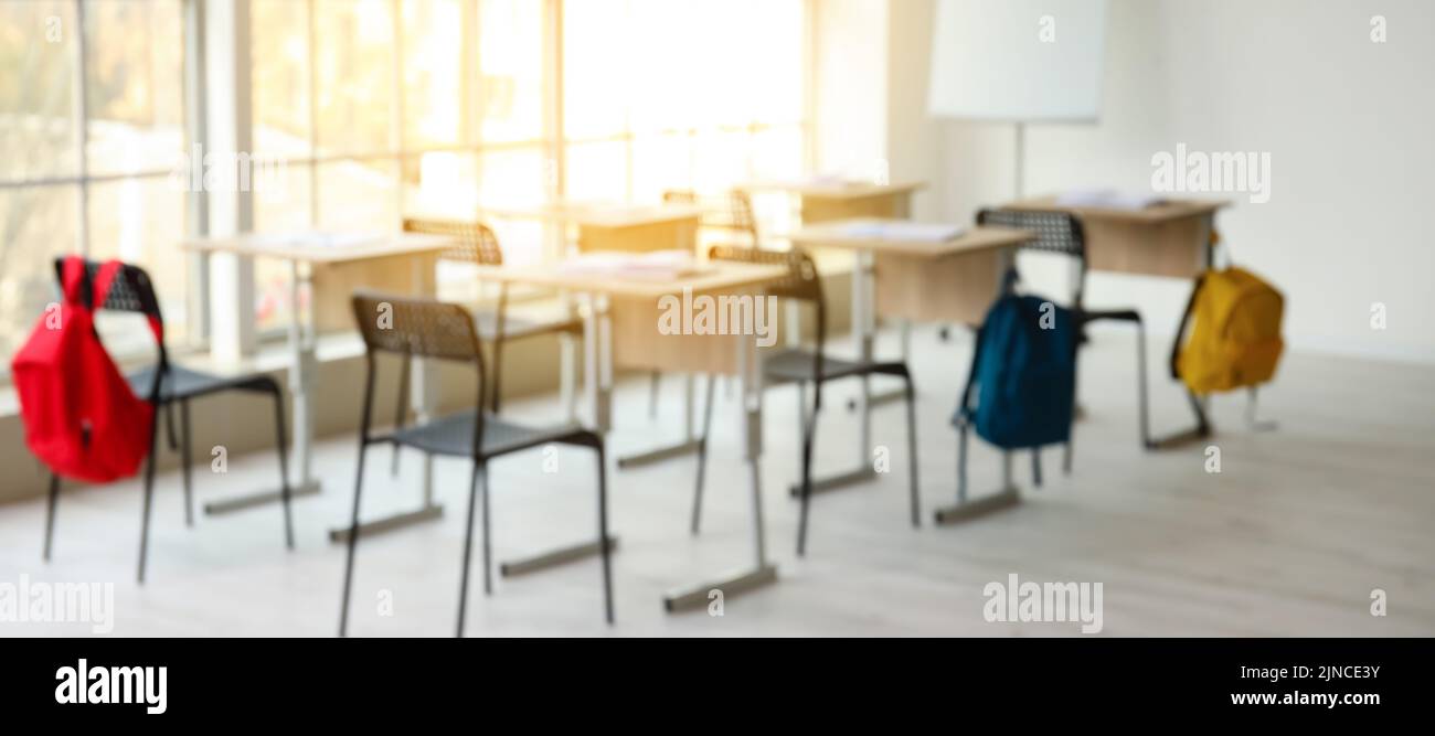 Interior of empty classroom, blurred view Stock Photo - Alamy