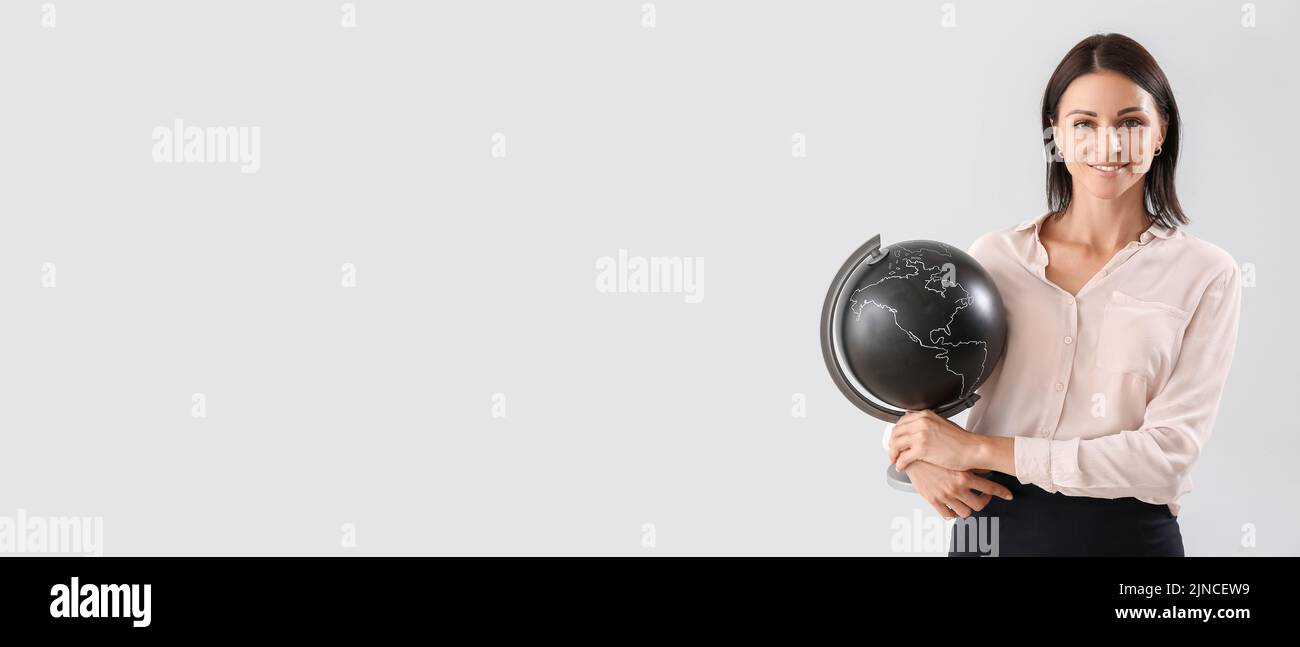 Female Geography teacher on light background with space for text Stock ...