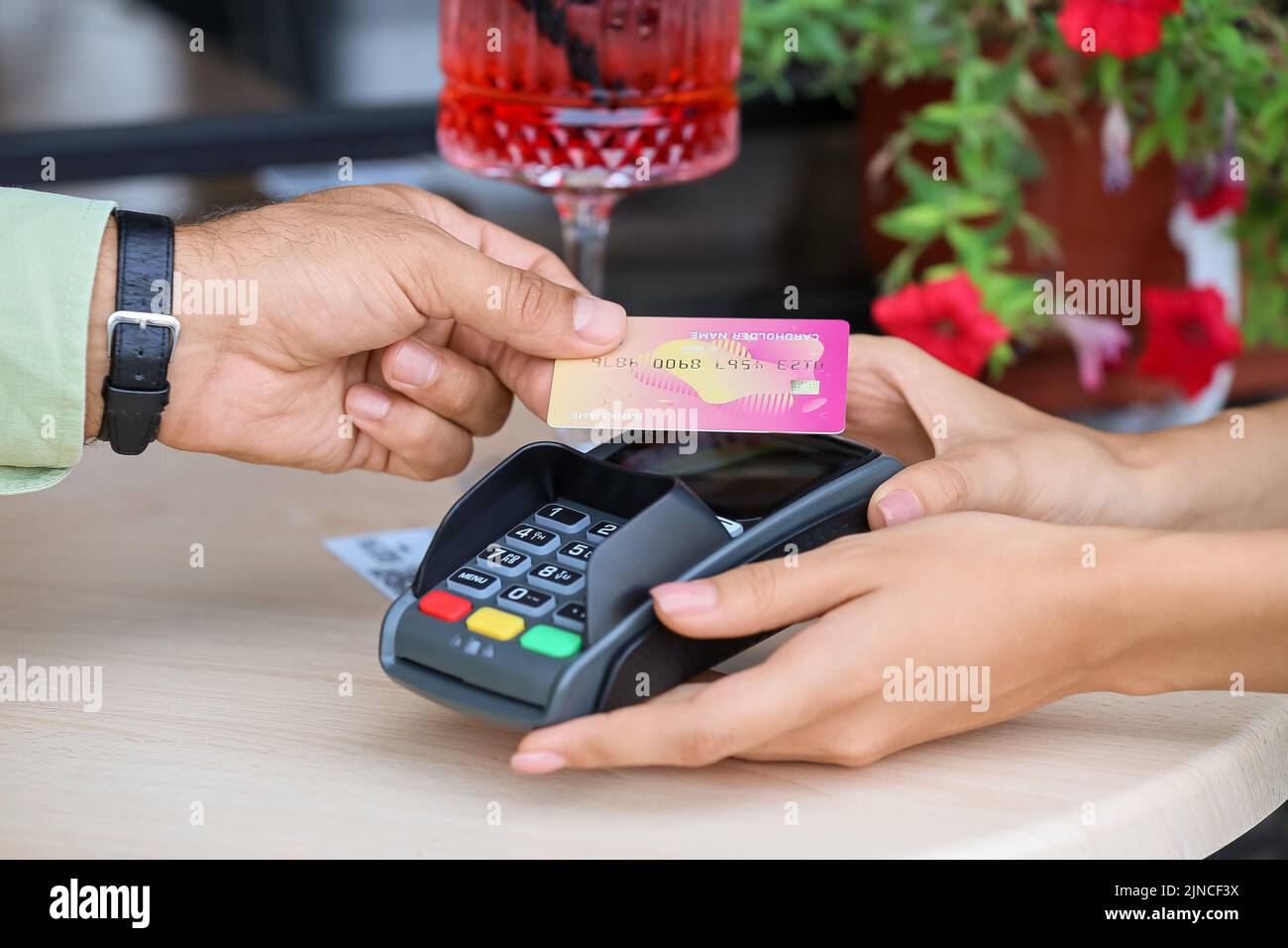 Woman card paying cocktail hi-res stock photography and images - Alamy