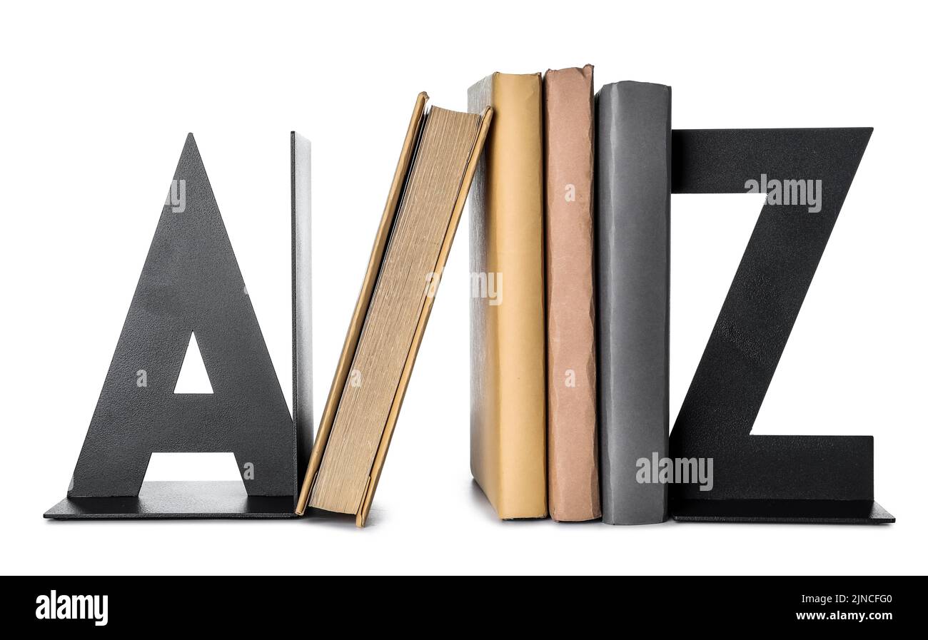 Stylish stand with books on white background Stock Photo - Alamy