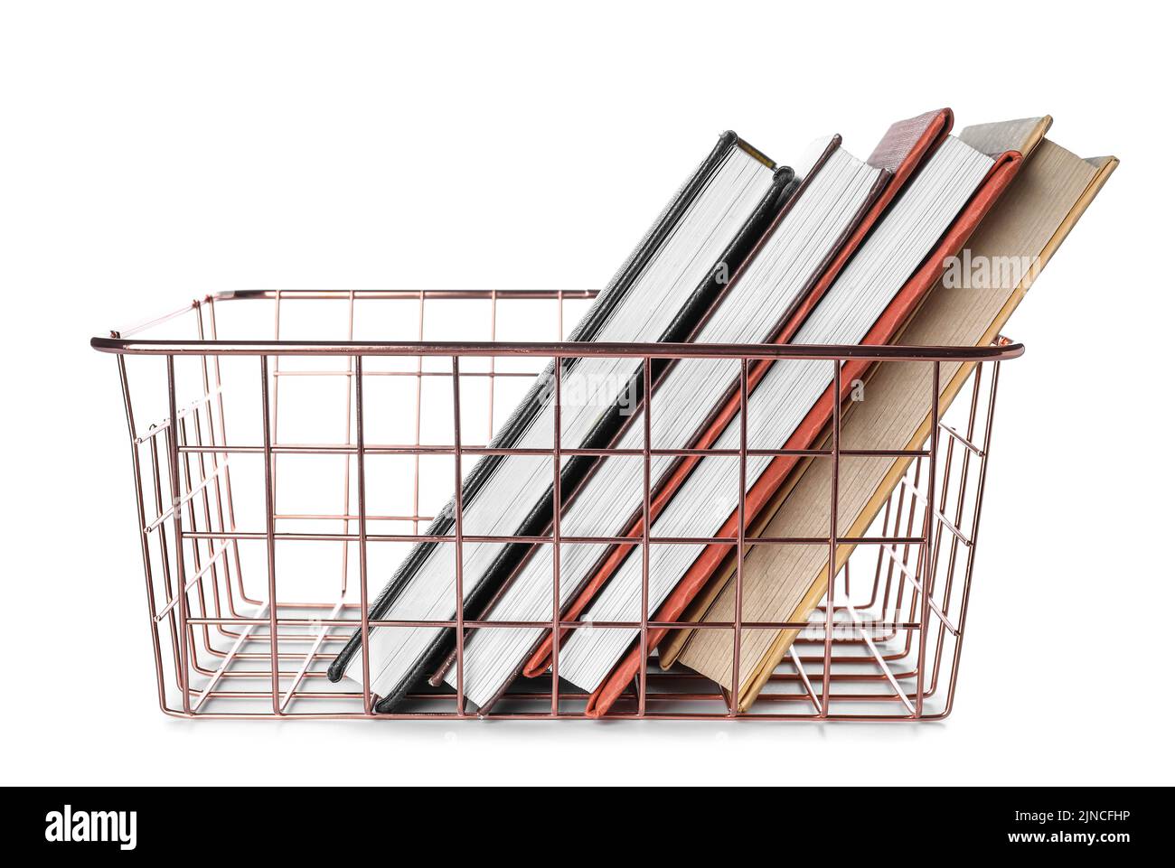 Pink metal basket with books on white background Stock Photo - Alamy