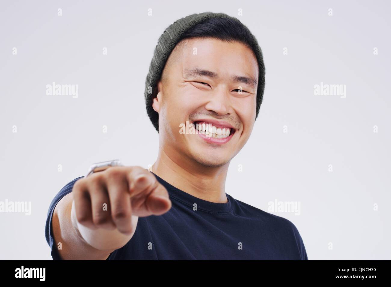 Take a look at that. Portrait of a handsome young man pointing towards ...