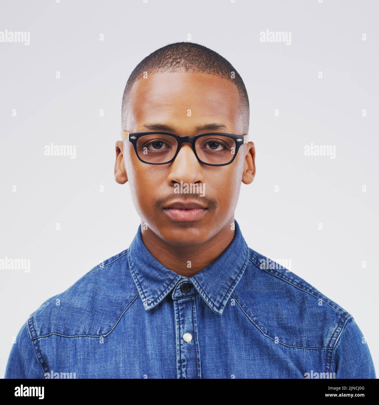 Hes impossible to read. Studio portrait of a handsome young man posing ...