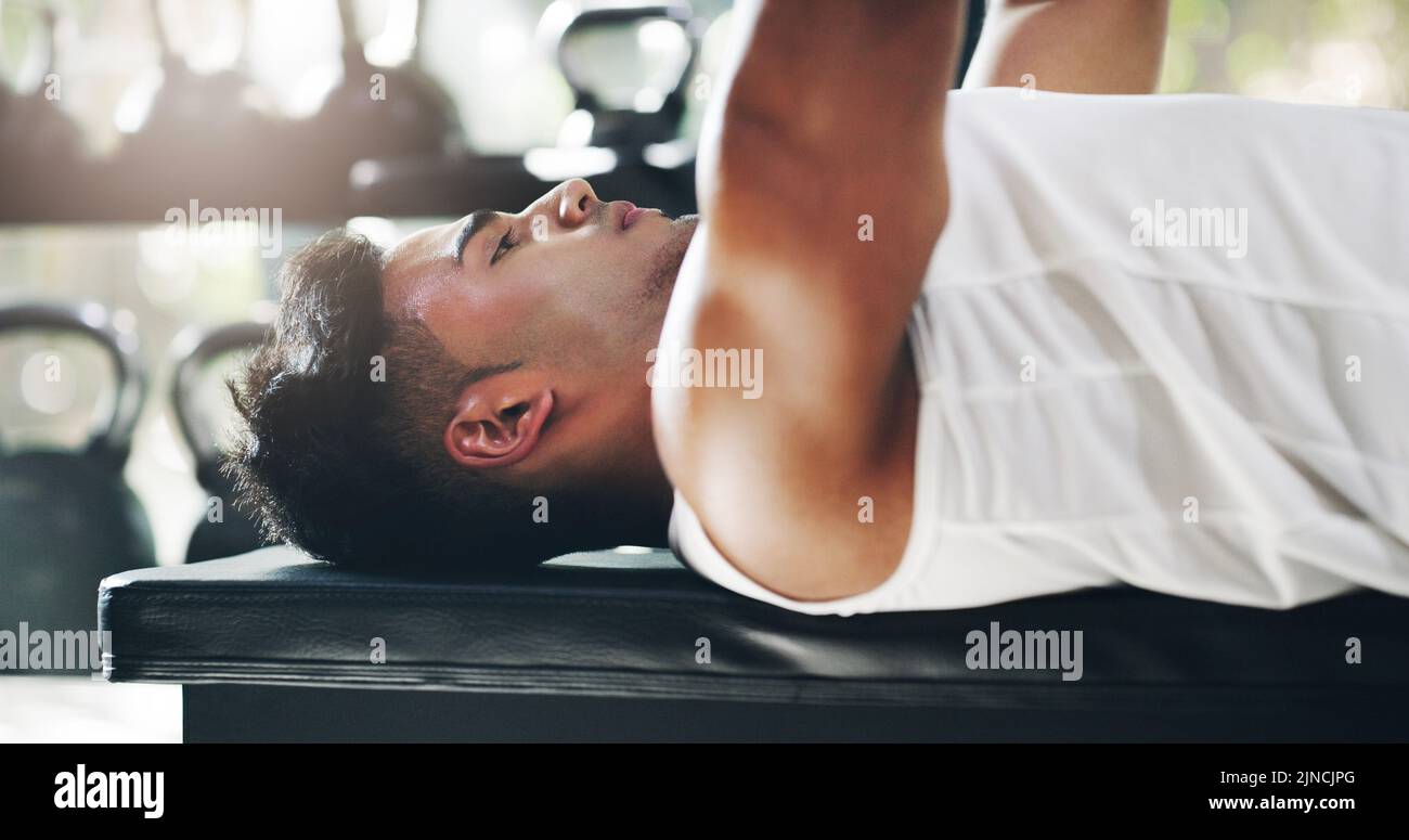 Quitting can never be an option. a handsome young sportsman working out ...