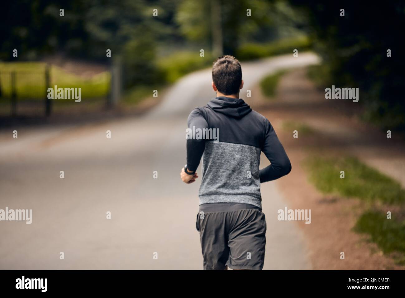 Handsome man looking back running hi-res stock photography and images ...