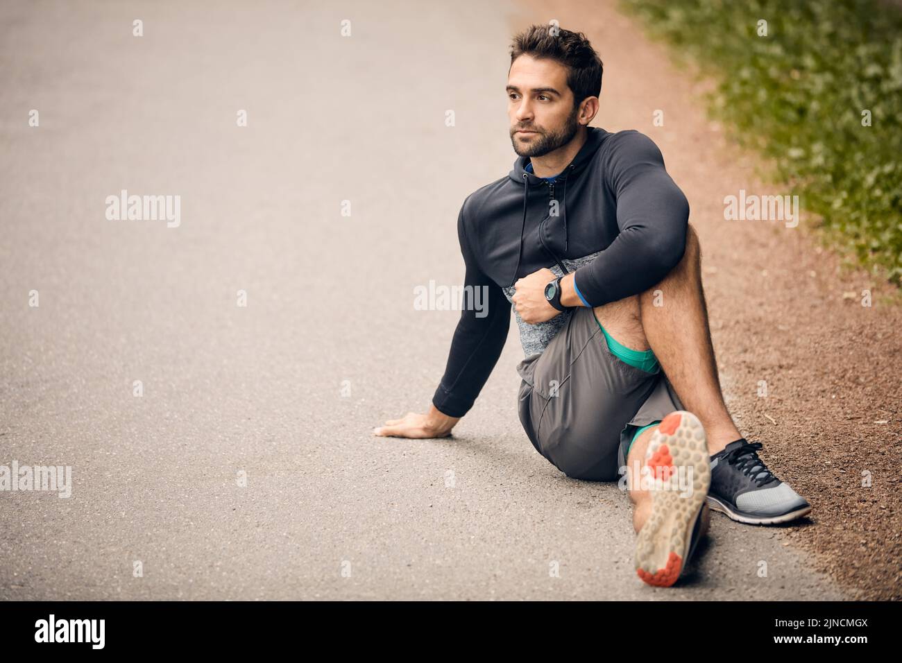Choose to be healthier. a sporty man starting his exercise routine with ...