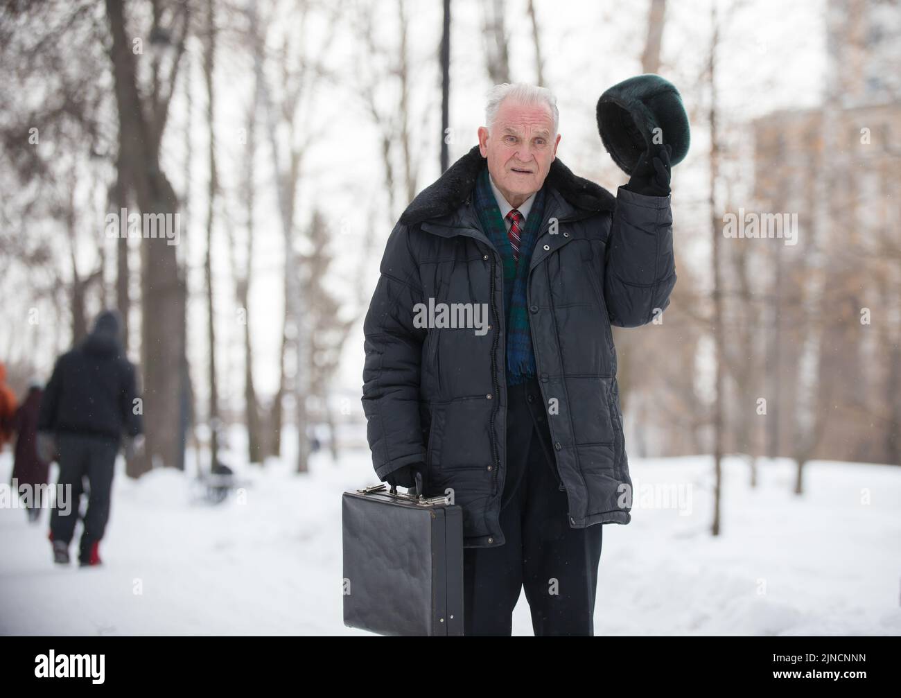 An old man with case takes off his hat outdoors Stock Photo - Alamy