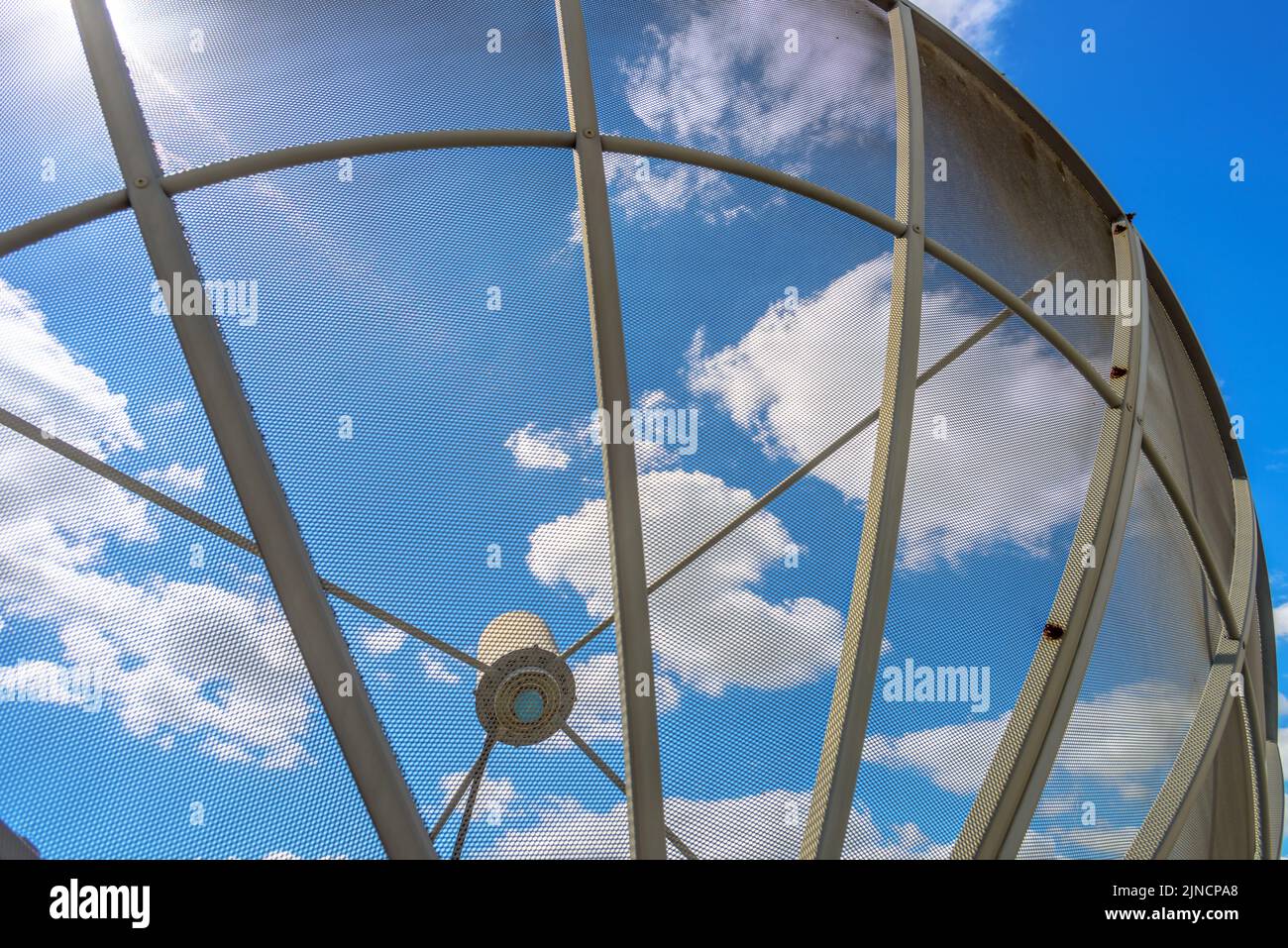 Satellite communications dish as viewed from behind the transparent ...