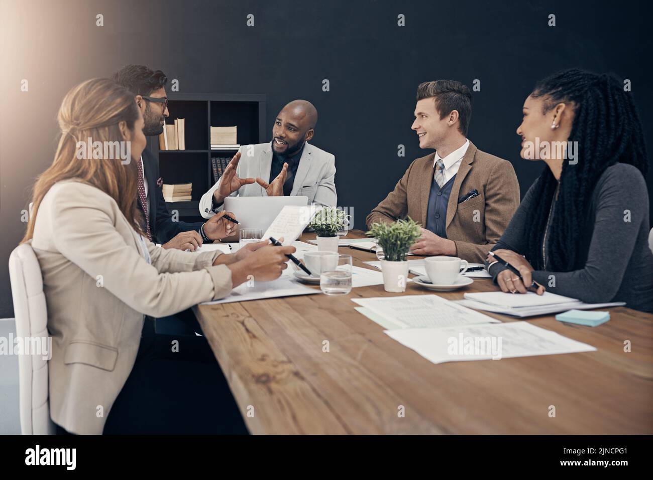 Meet and get business moving. a group of young businesspeople having a ...