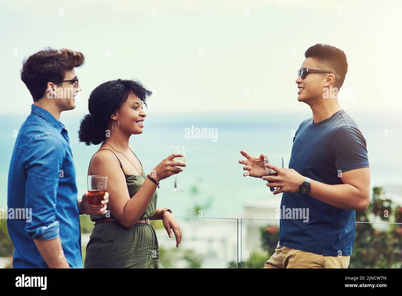 Fun in the sun with my mates. a group of friends having drinks and ...