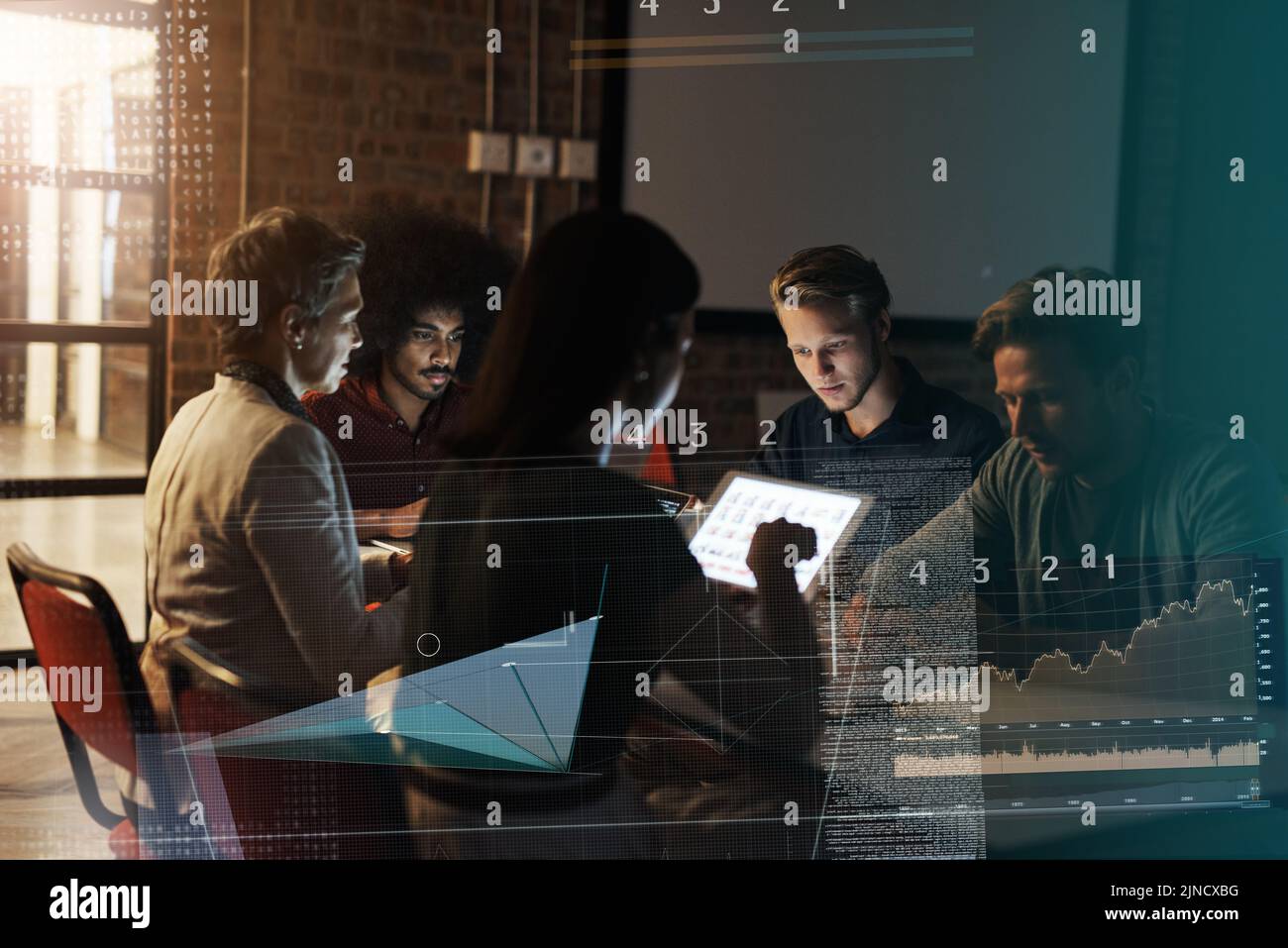 Modern day meetings. a group of young businesspeople sitting around a ...