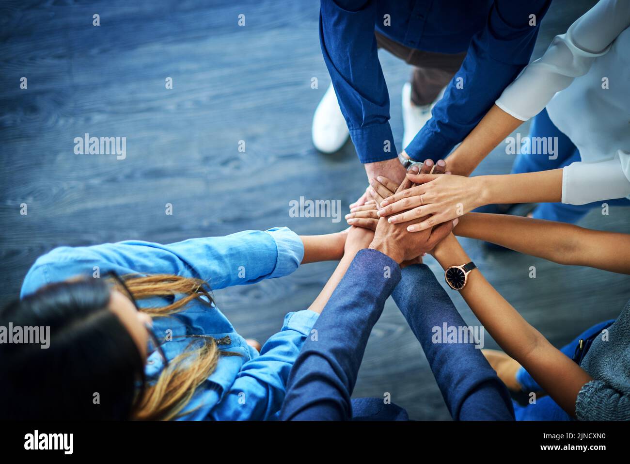 Nothing can beat united minds. High angle shot of a group ...