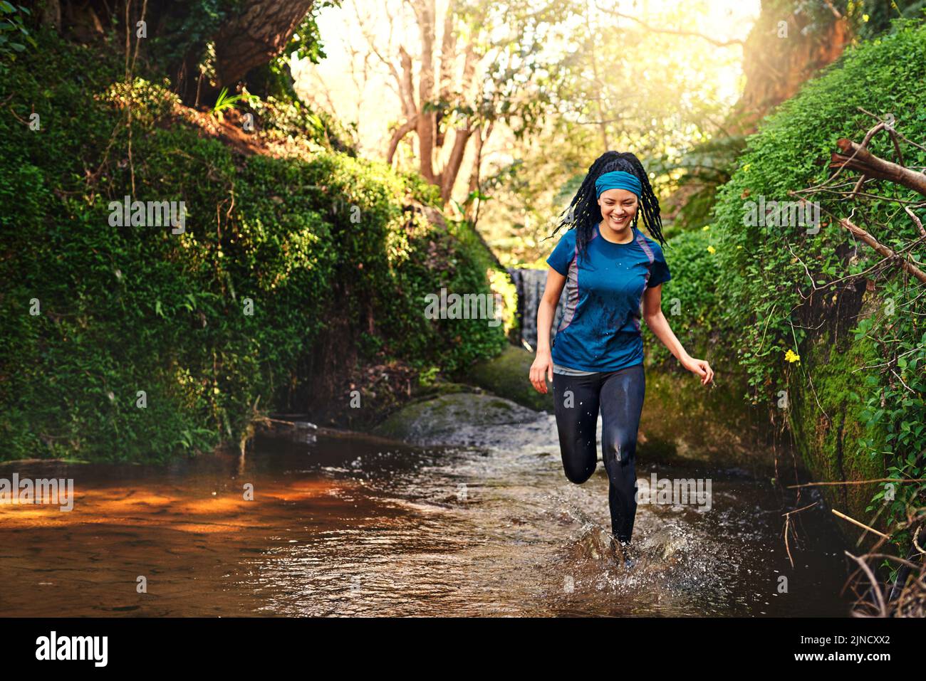 Exercise and have fun while doing it. a sporty young running through a ...