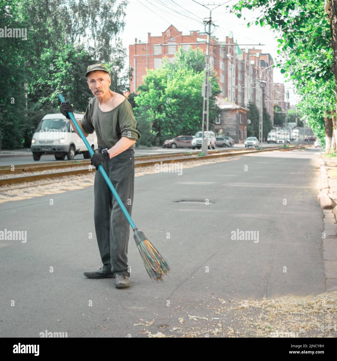 15th of June 2022, Russia, Tomsk, street cleaner on city background ...