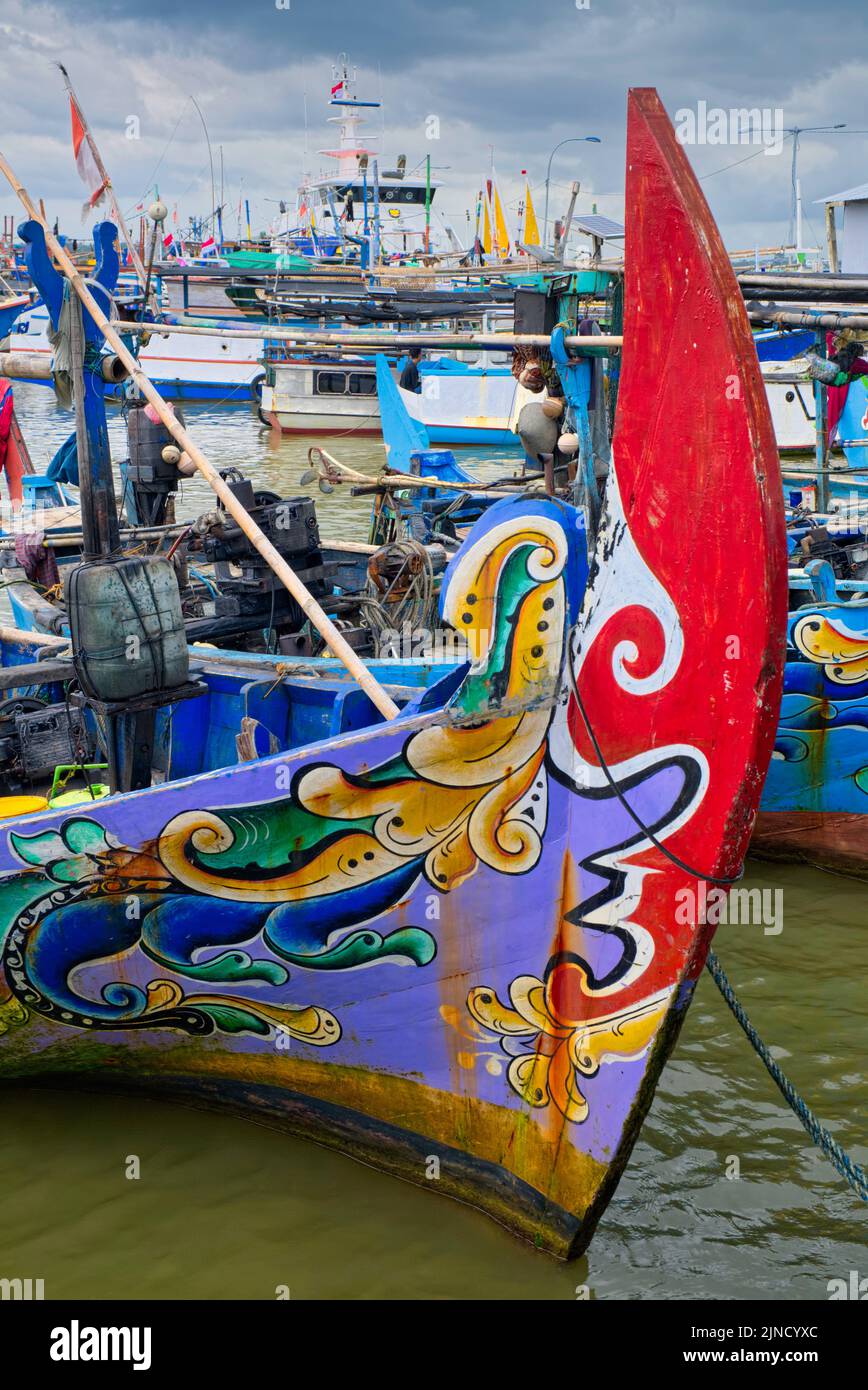 The fishing boats look beautiful with colorful pictures on the hull ...