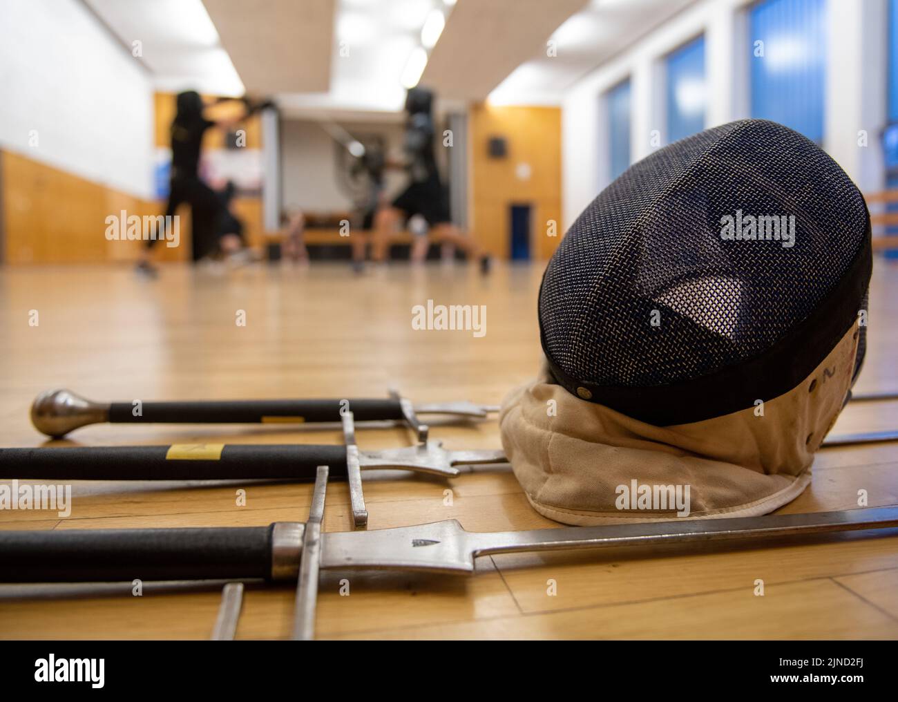 Fencing mask and swords hi-res stock photography and images - Alamy