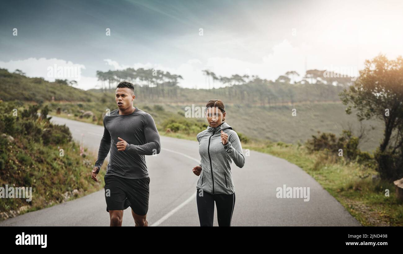 Two young people running outdoor hi-res stock photography and images ...