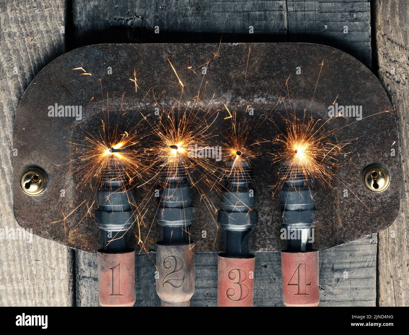Fourth Advent background with four spark plugs on rusty sign, car ...