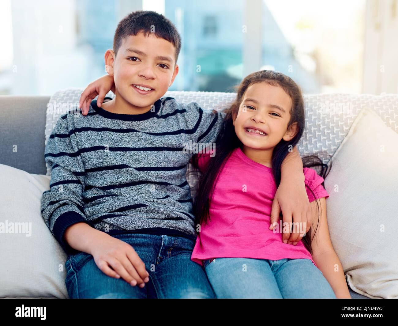 Sibling love at an all time high. Portrait of two adorable young ...