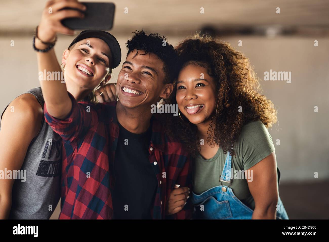 Lets make some memories. Portrait of a group of cheerful young friends ...