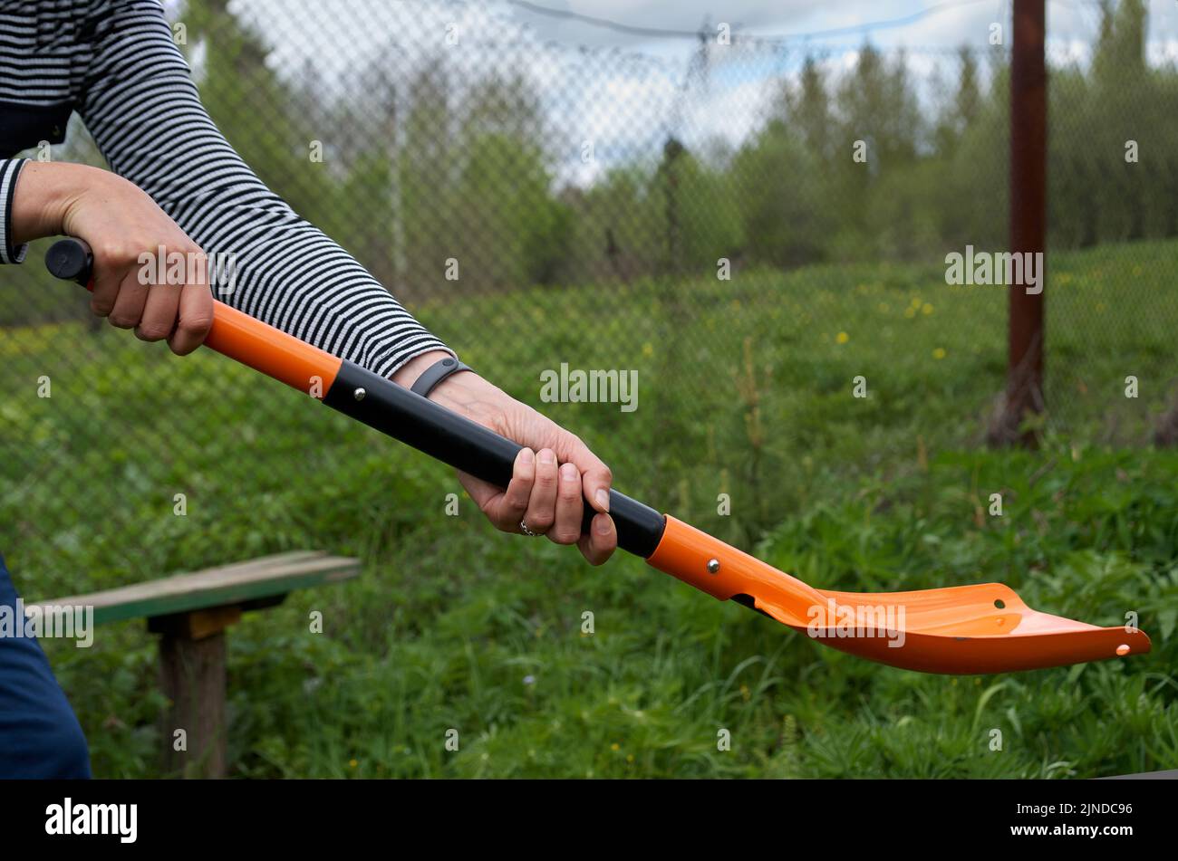 Human hands with shovel digging garden bed or farm. Farming, gardening ...