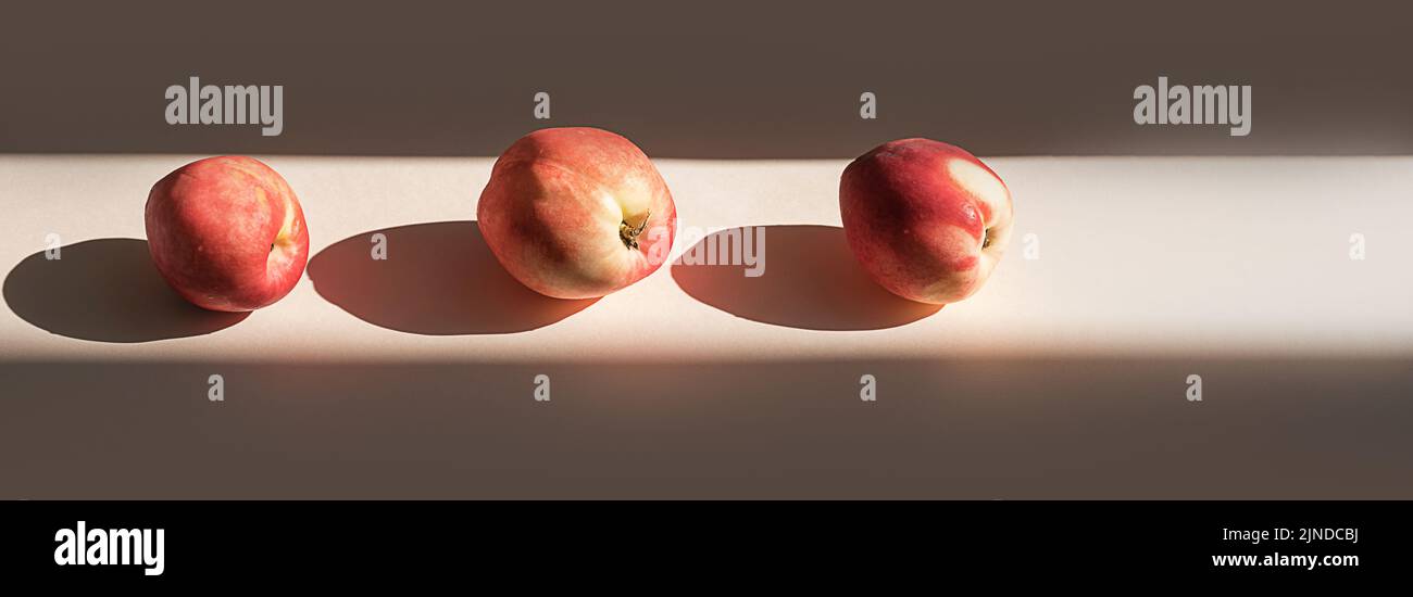 Peaches in sunlight. Minimalism, trendy still life with shadow Stock ...