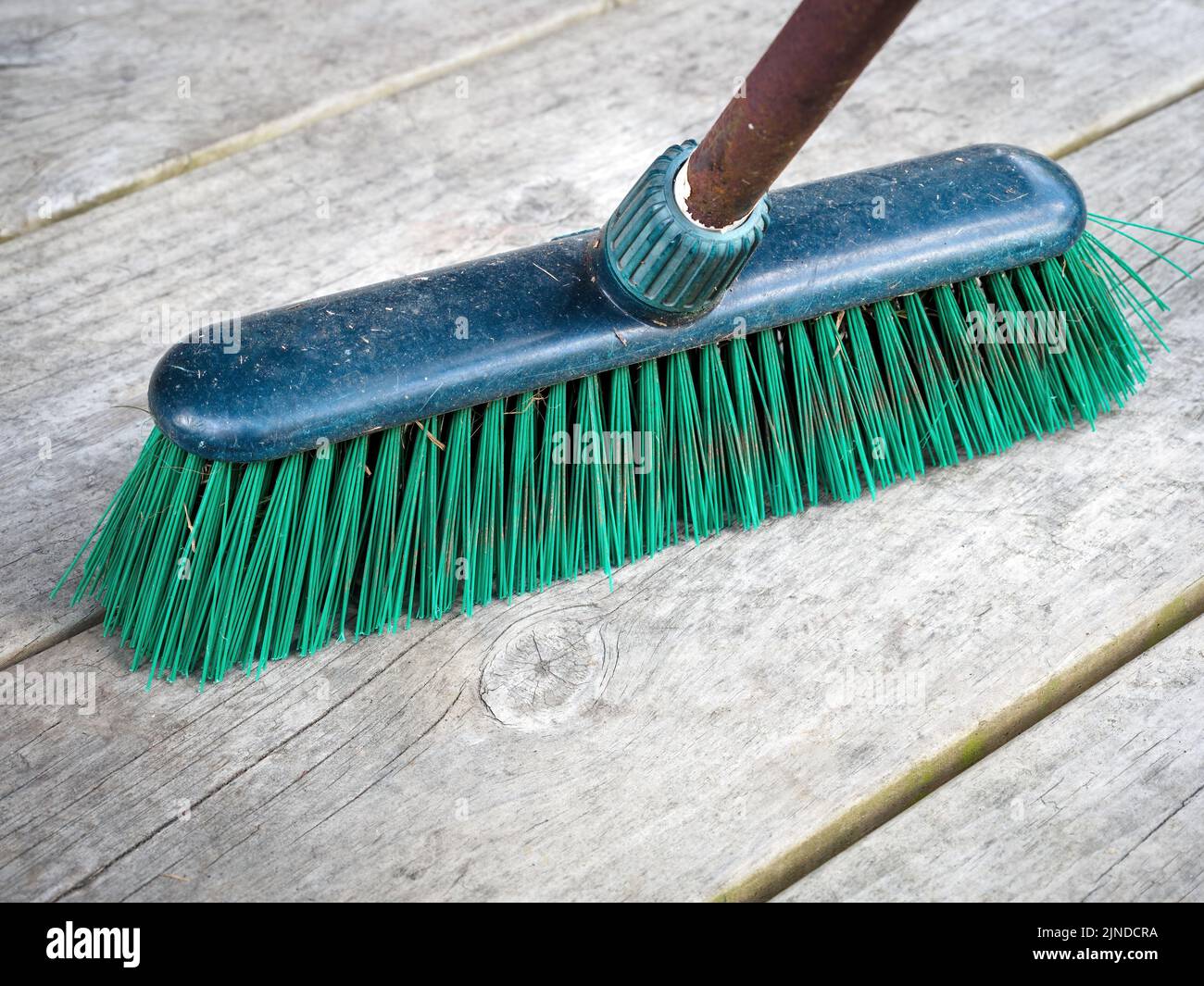 View of Outdoor broom with stiff green plastic bristles for backyard ...