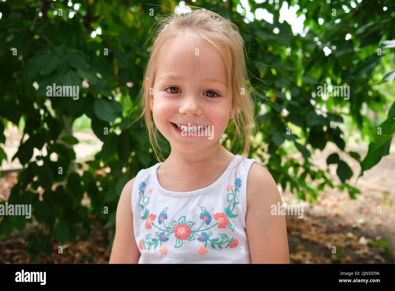 portrait beautiful Happy child girl smiling during summer time outdoors ...