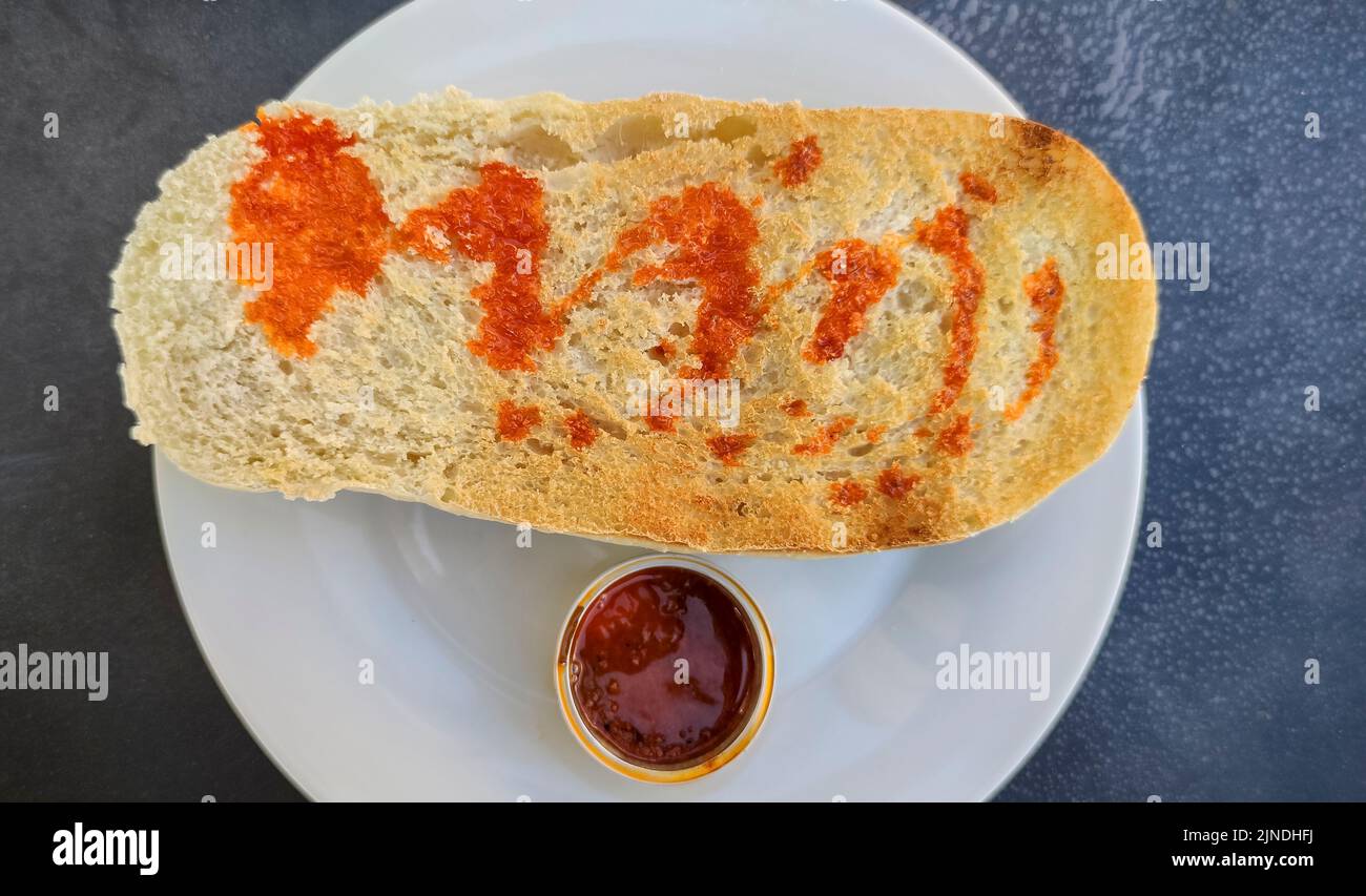 Iberian cachuela bread toast. Single-serve cachuela container Stock ...