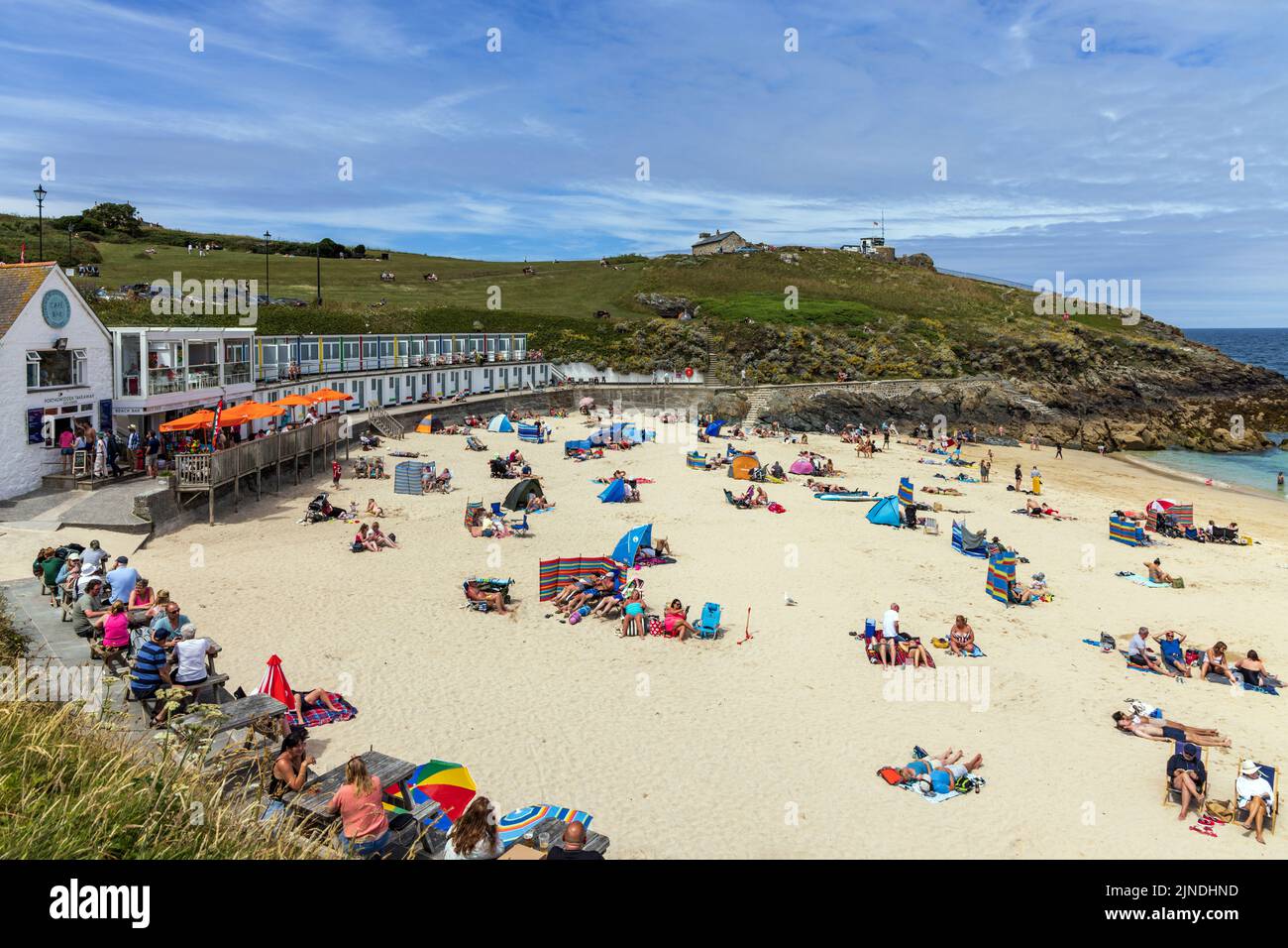 People enjoying a sunny summer's day at Porthmeor Beach in St Ives ...