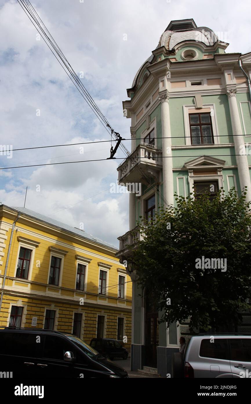 Two contrasting old buildings in Chernivtsi city center, Ukraine Stock ...