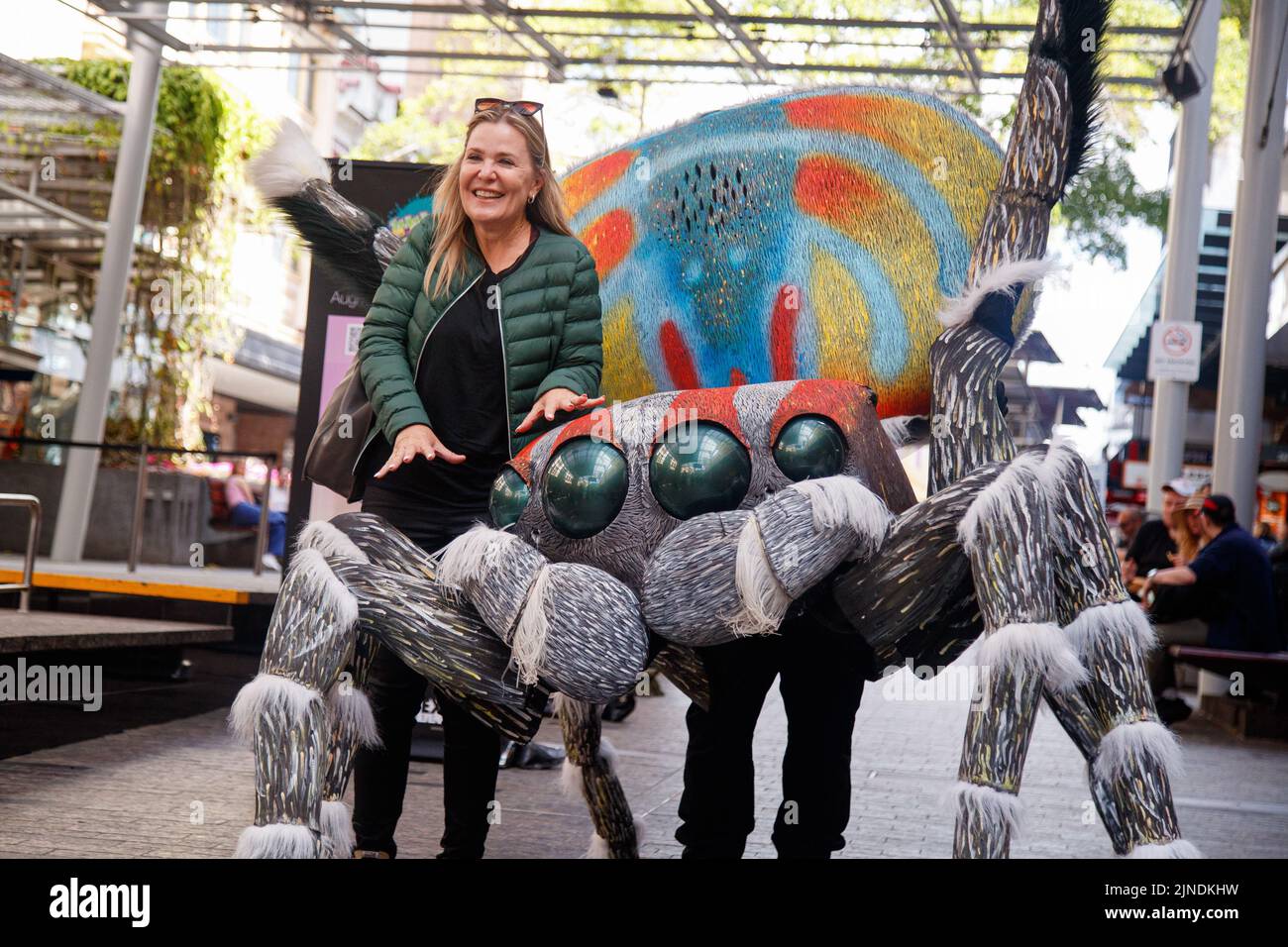 Brisbane, Australia. 11th Aug, 2022. A woman poses with a person in a ...